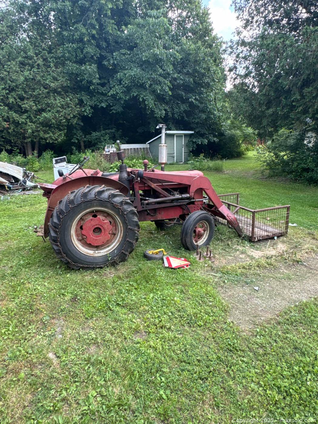 McCormick Super W4 farm tractor with loader and extra implement | Maxsold