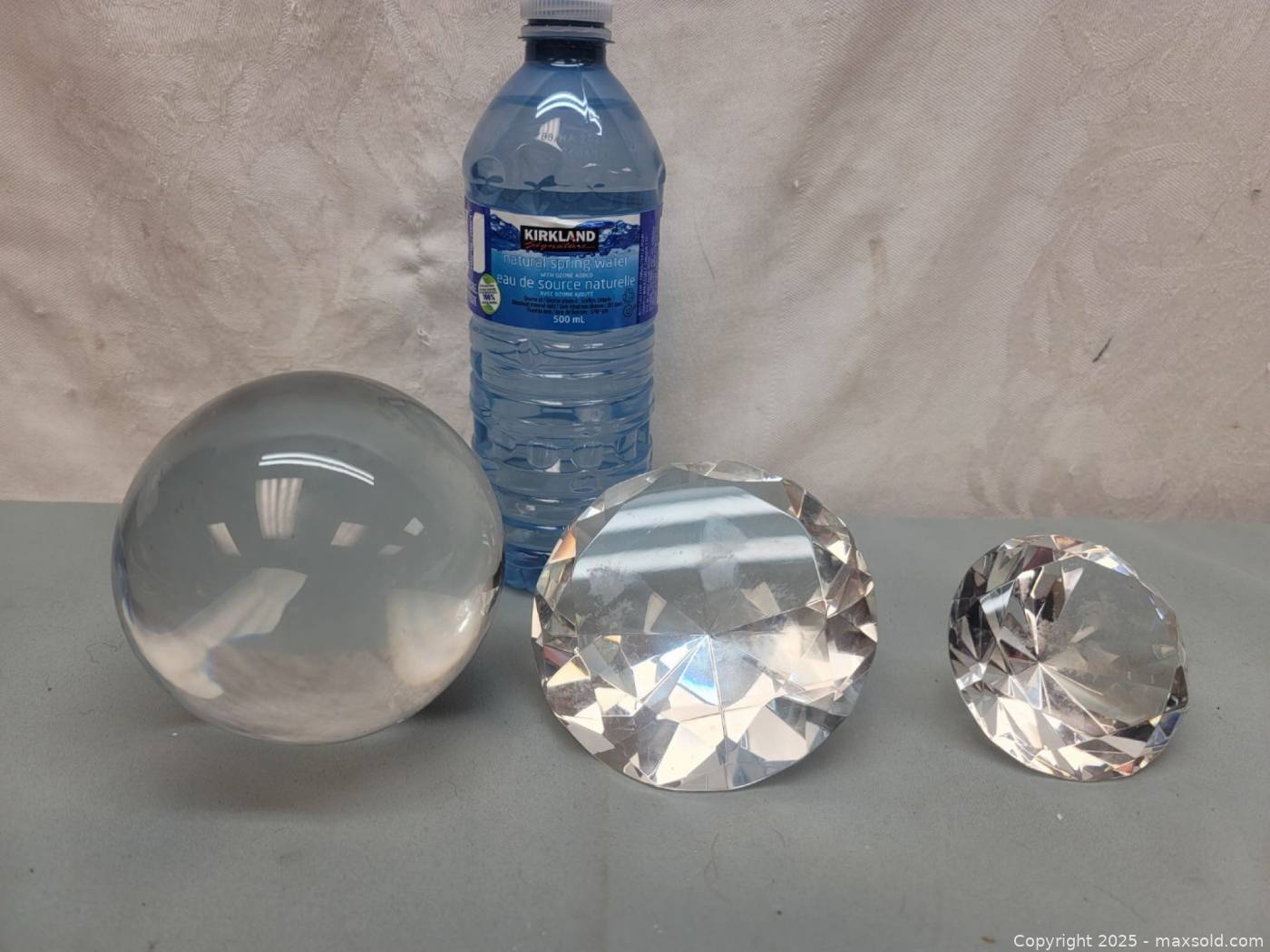 Glass sphere and two faceted diamond paperweights | Maxsold