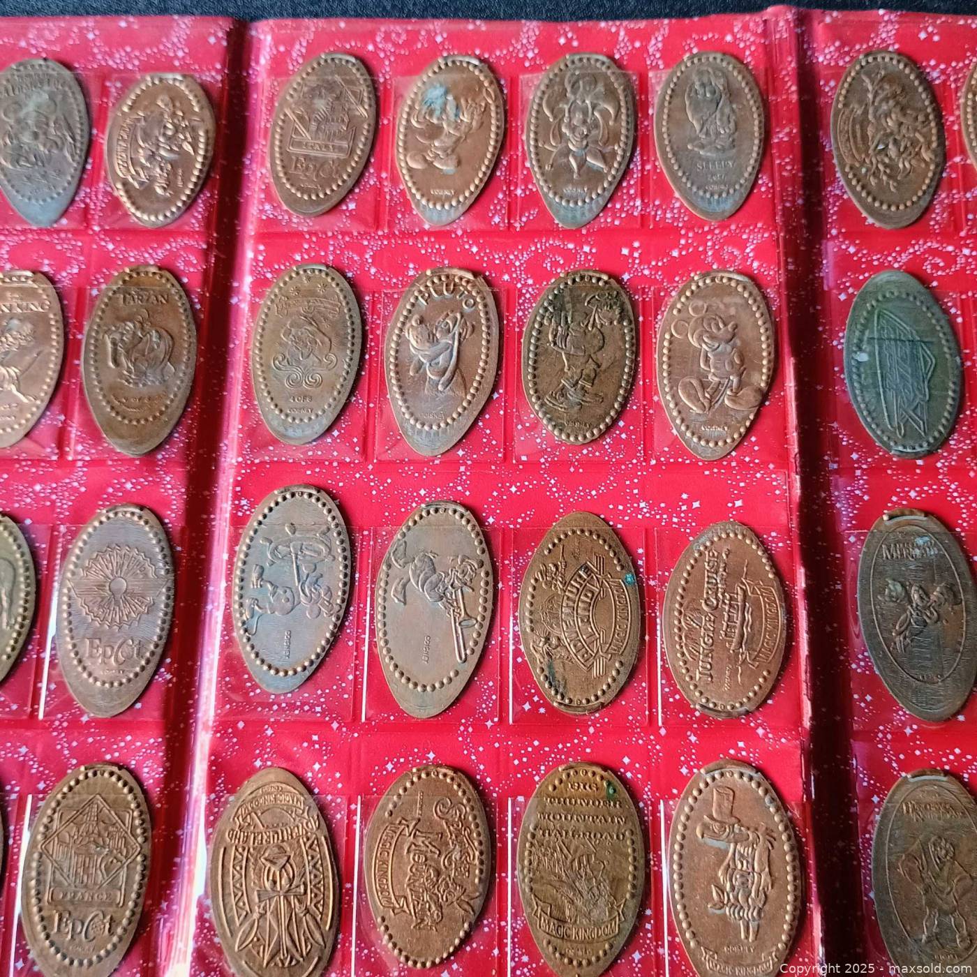 Disney pressed coin collection album with 64 elongated pennies | Maxsold