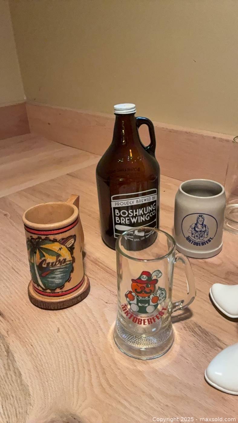 Beer steins, mugs, novelty boot cups, glass growler | Maxsold