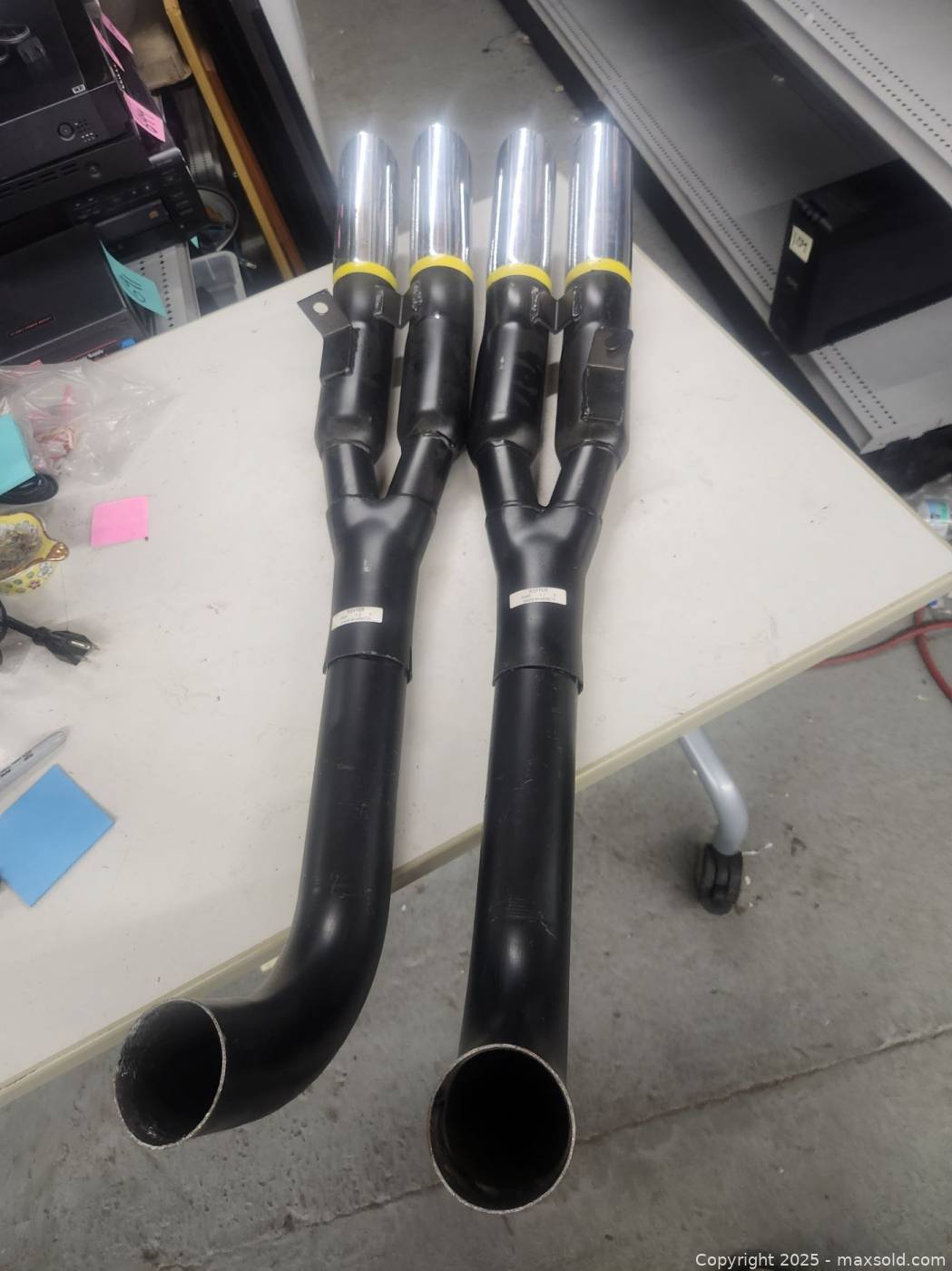 Pair of dual chrome-tip exhaust pipes | Maxsold