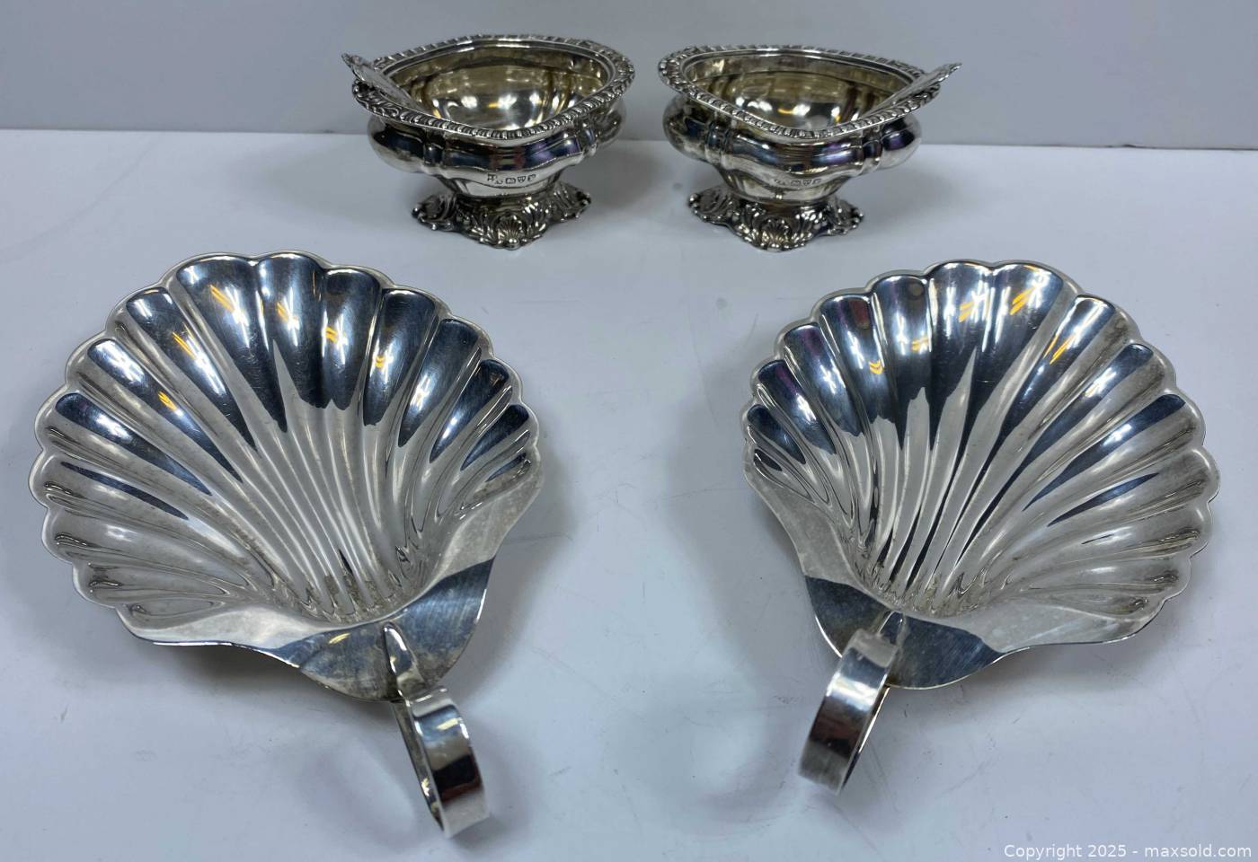 Sterling silver salt cellars, shell dishes, EPNS spoons | Maxsold