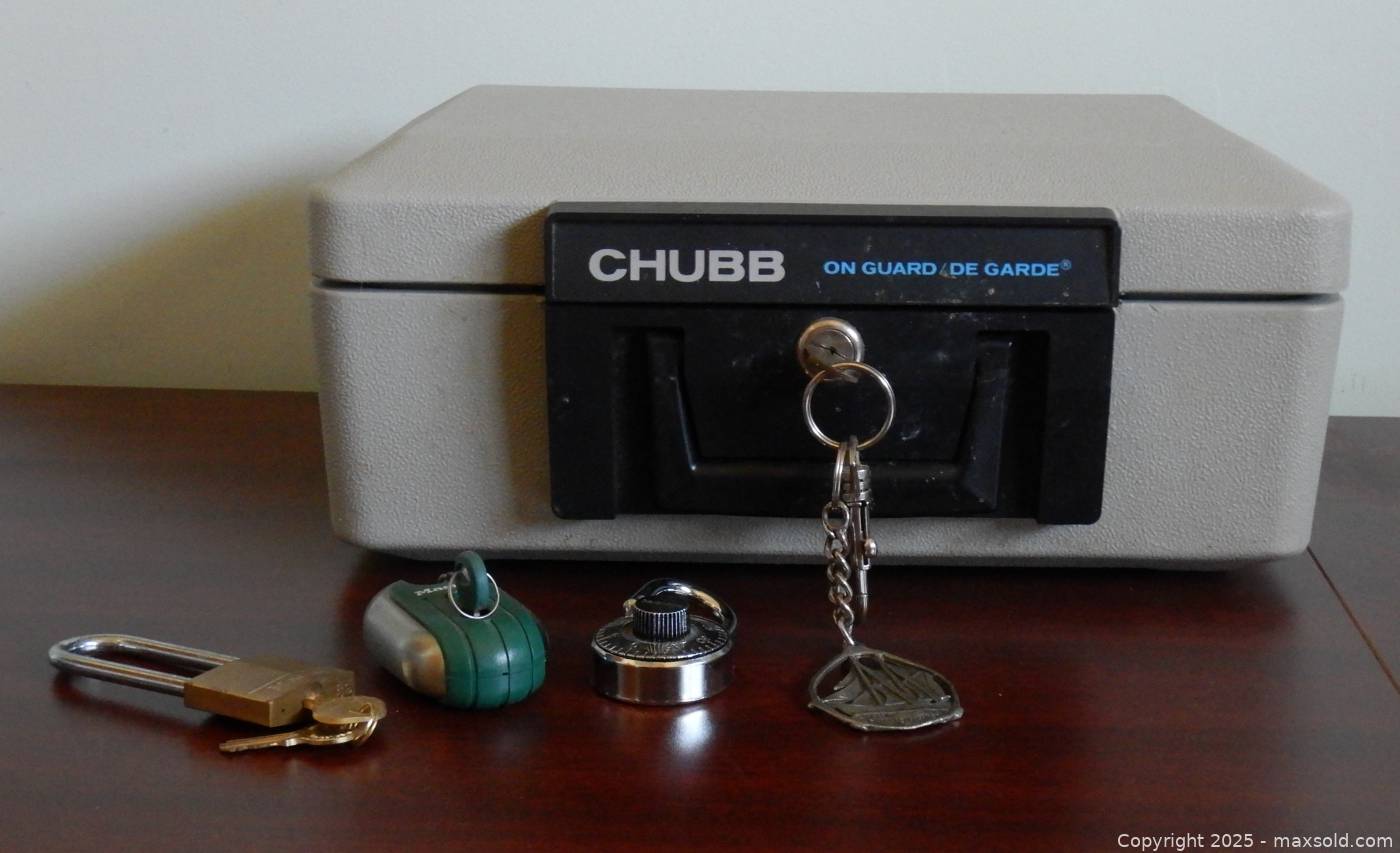 Chubb On Guard portable safe with three padlocks | Maxsold