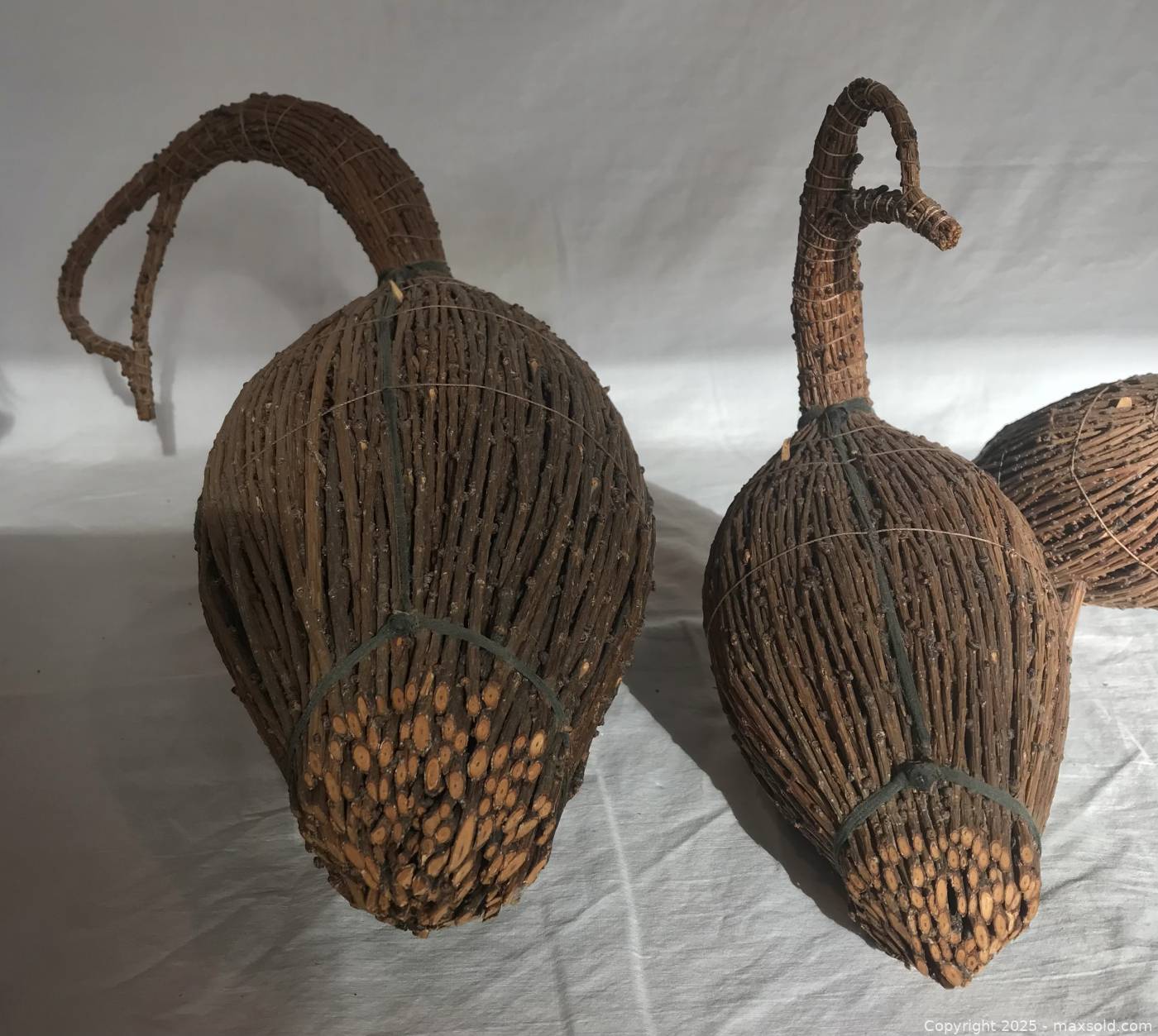 Three Cree handmade tamarack goose sculptures | Maxsold