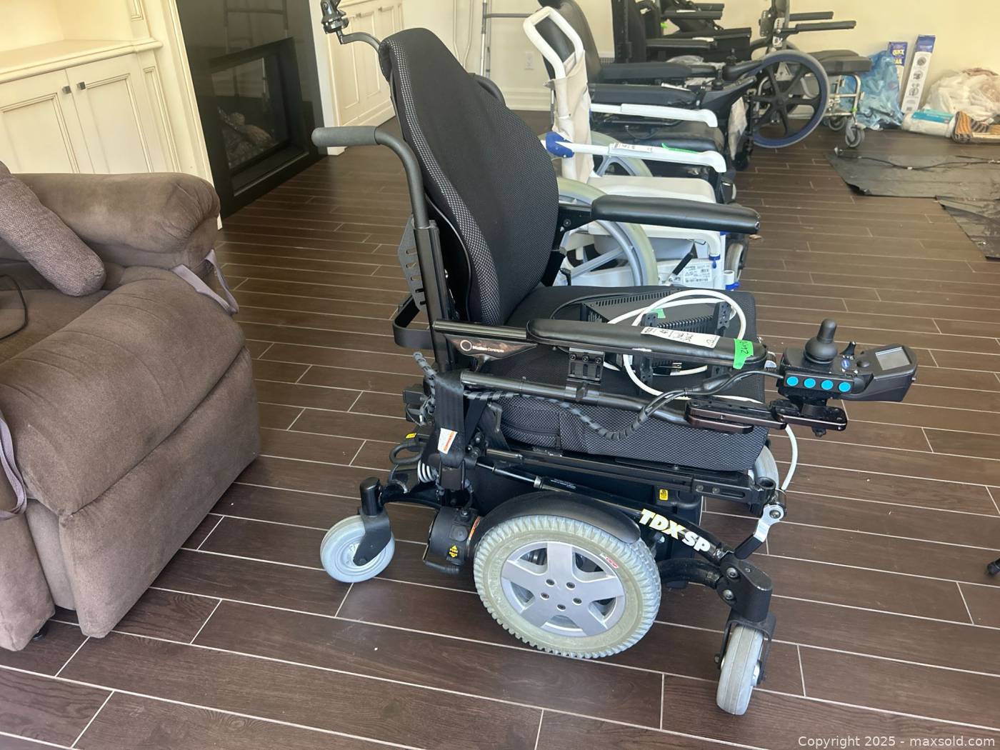Invacare TDX SP electric wheelchair with charger | Maxsold