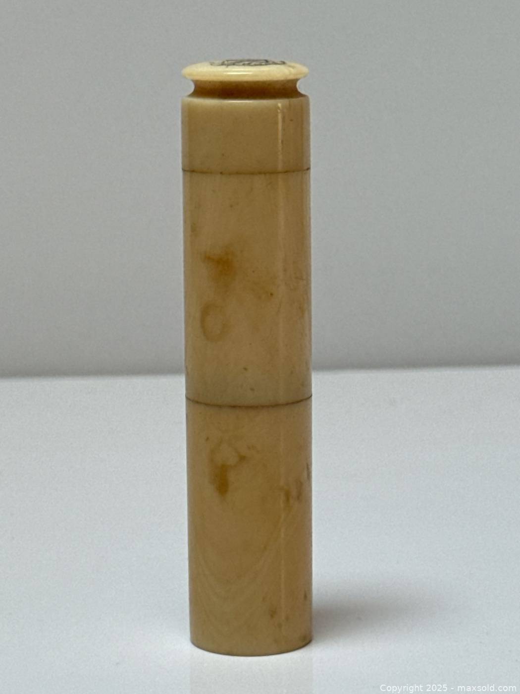 Antique cylindrical sewing needle case with engraved crest | Maxsold