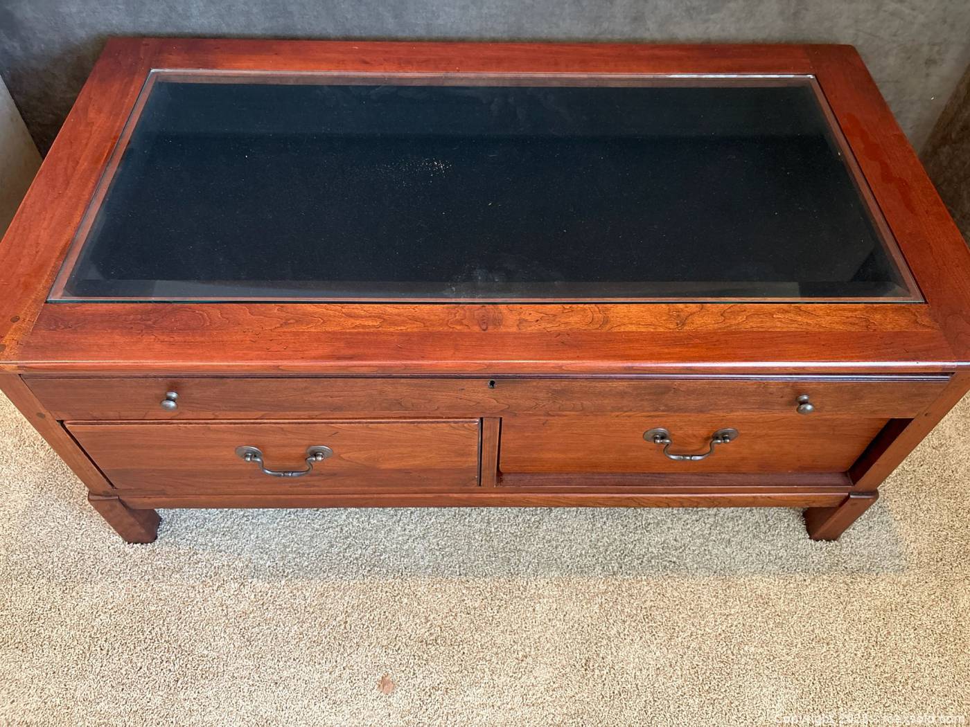 Rectangular solid wood coffee table with glass inset top | Maxsold