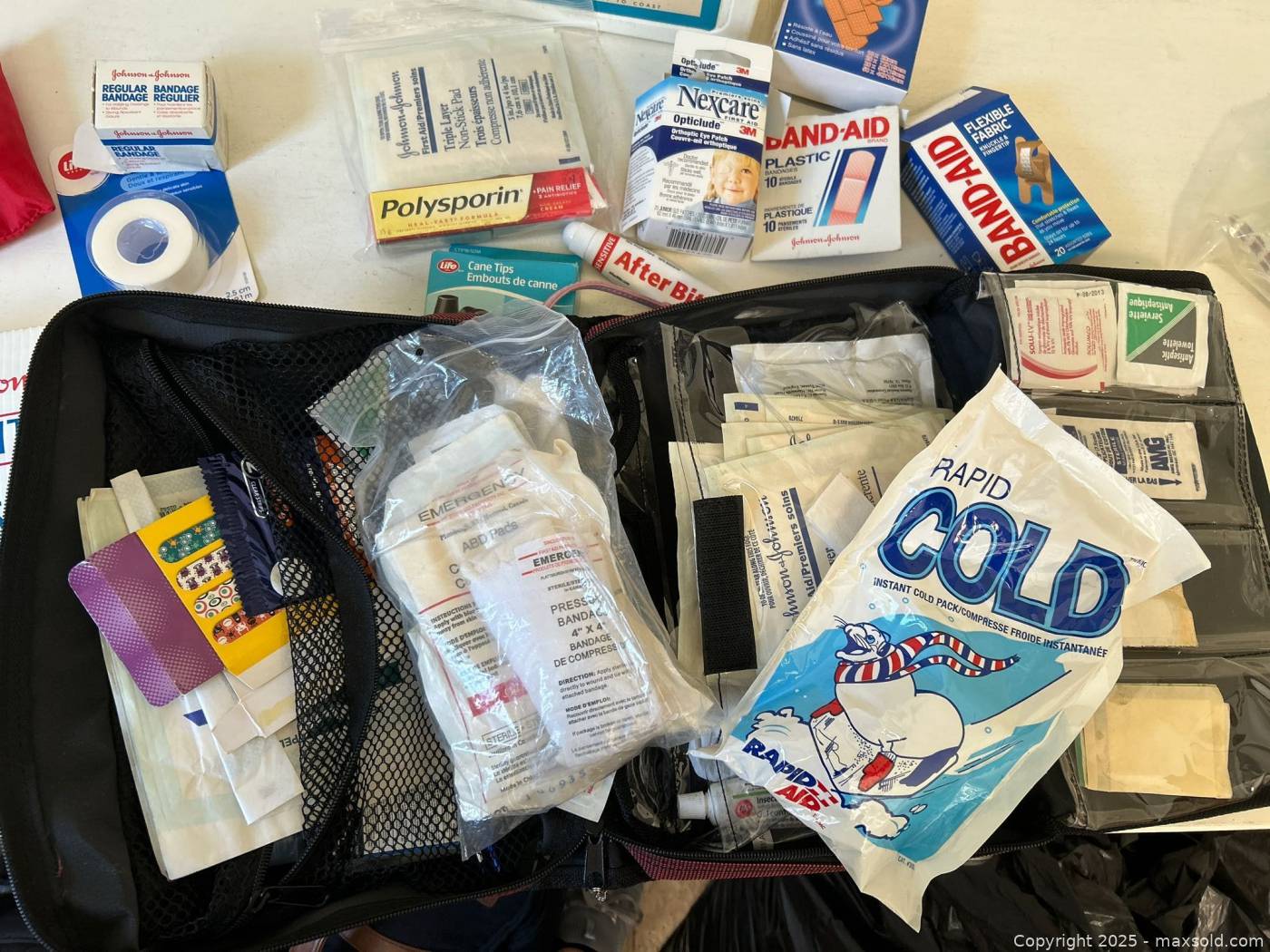 Assorted First Aid Supplies including Kits, Band-Aids, Creams, Cold ...