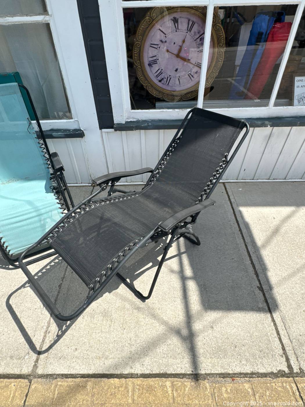 Three zero gravity reclining patio chairs | Maxsold