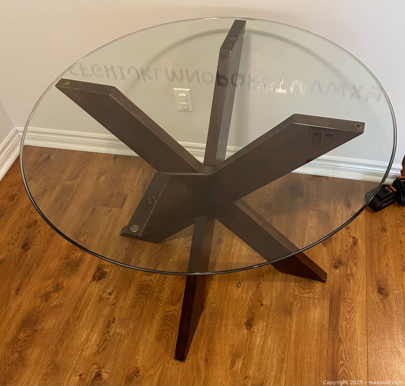 Round glass dining table with wood base | Maxsold