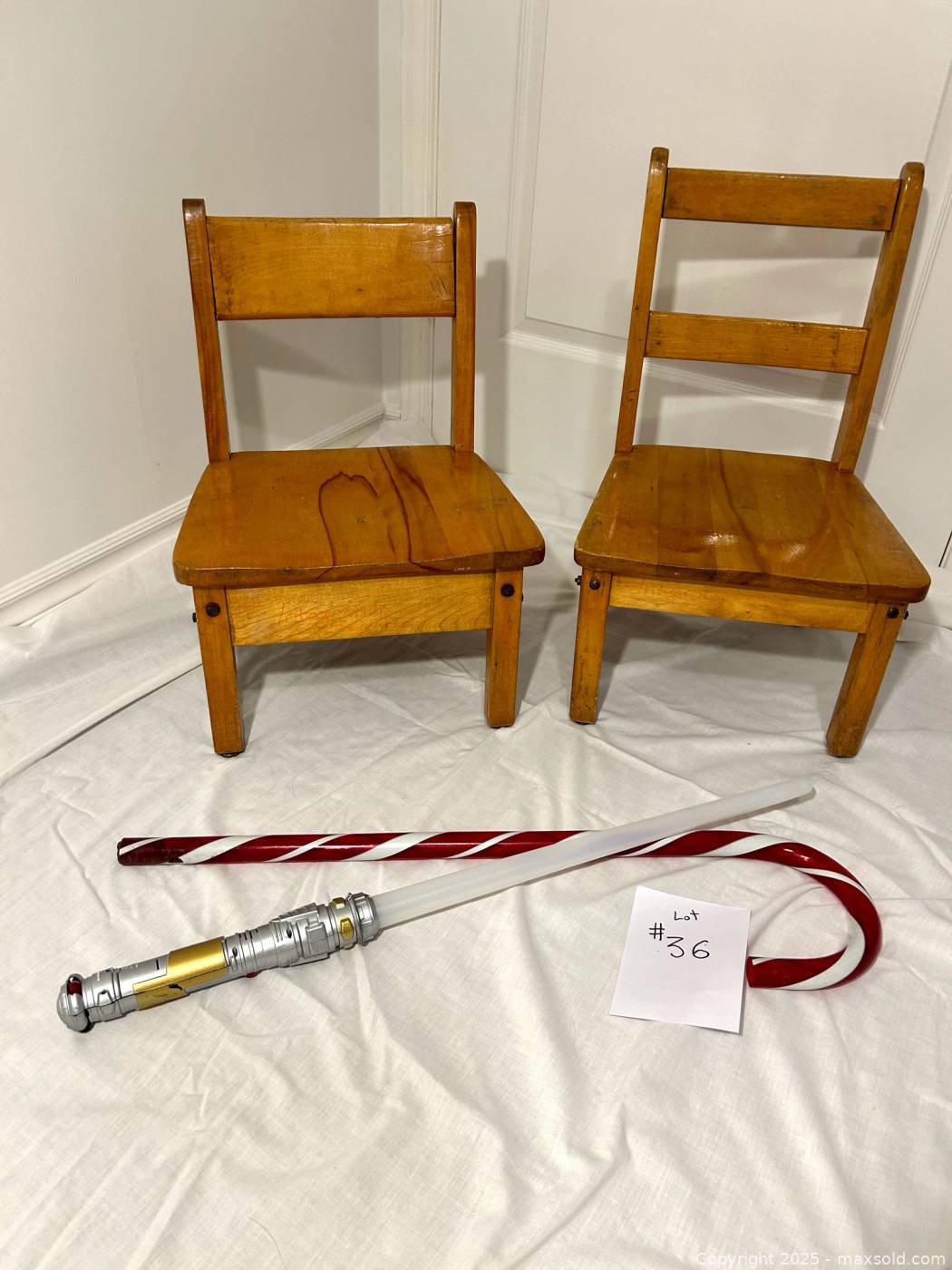 Solid wood kids chairs, toy lightsaber, candy cane prop | Maxsold