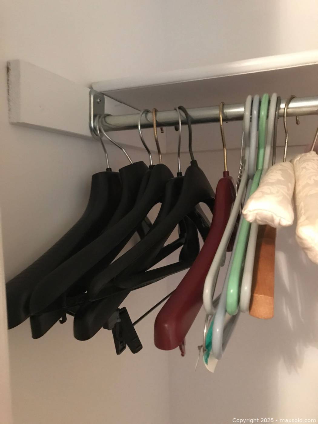 Assorted clothes hangers and table linens | Maxsold