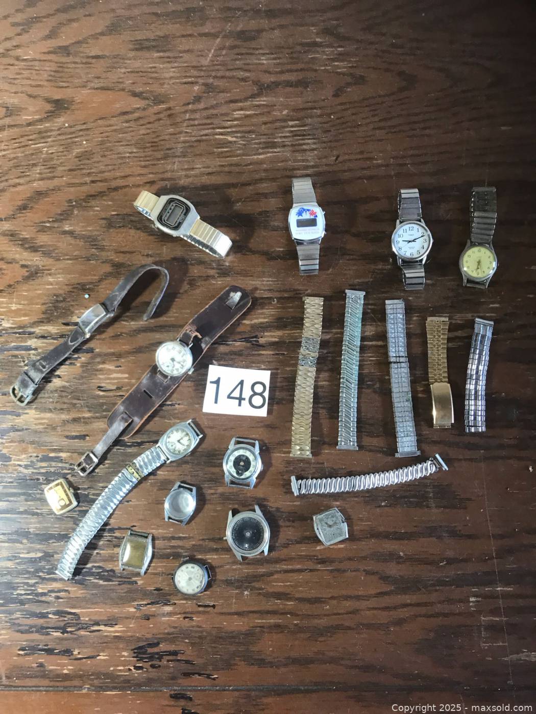 Vintage wristwatches, loose watch heads and metal bands | Maxsold