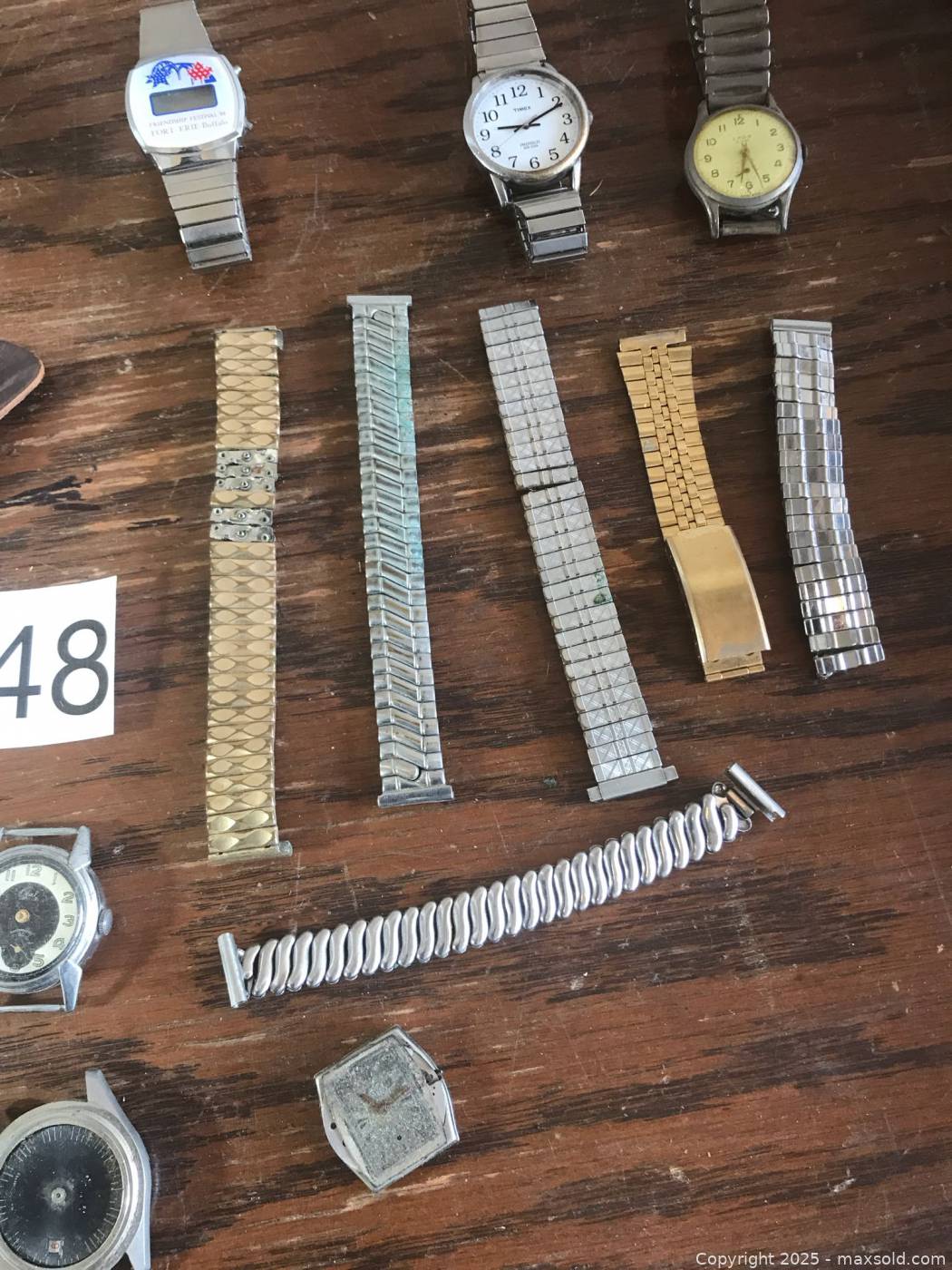 Vintage wristwatches, loose watch heads and metal bands | Maxsold