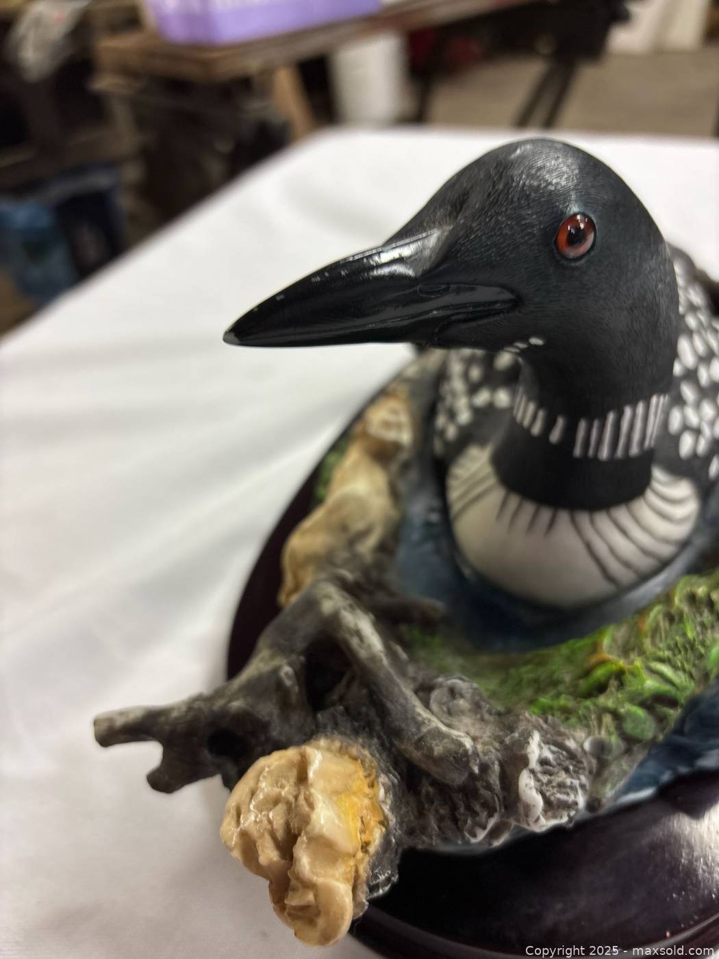 Resin loon sculpture and 2 small wooden decoys | Maxsold