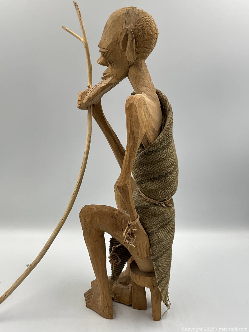 Hand-carved wooden elderly man figure | Maxsold