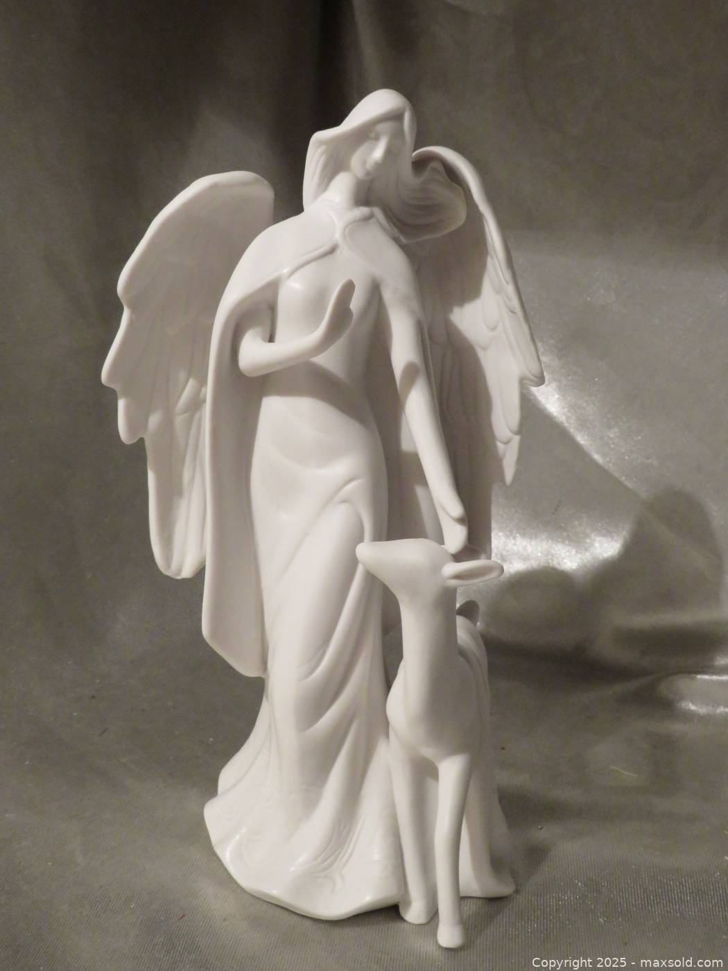 Pacific Rim matte white angel figurine with fawn | Maxsold