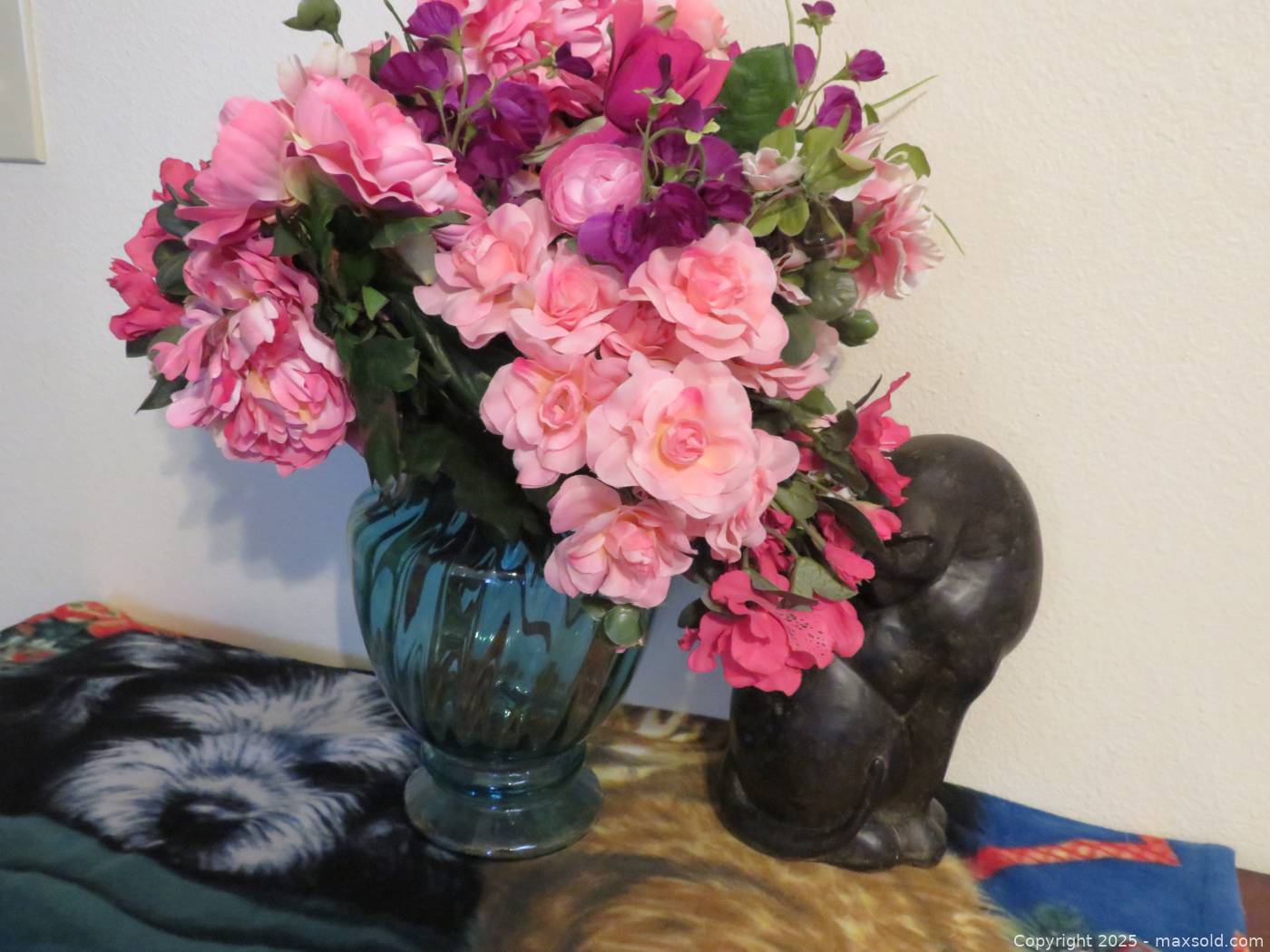 Humane Society blanket, glass vase with flowers and cat figurine | Maxsold