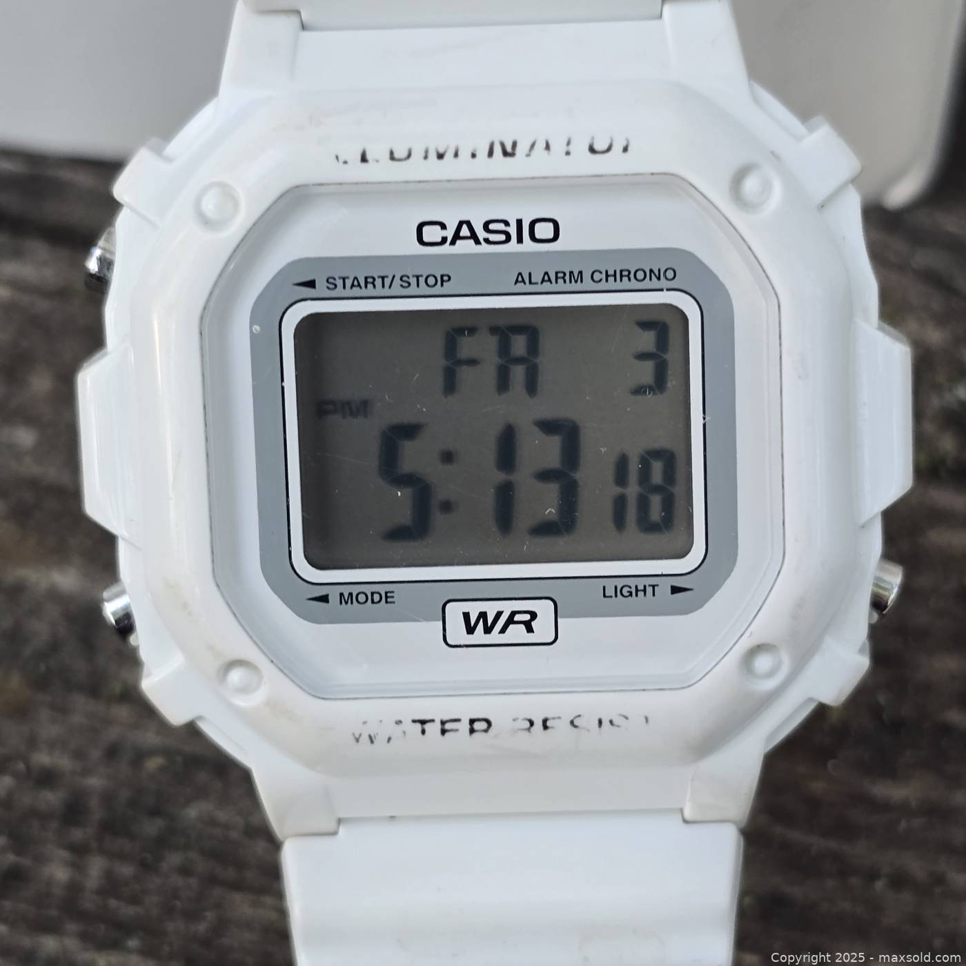 Casio Illuminator watch, pink JYouPro smartwatch, black Fitbit with ...