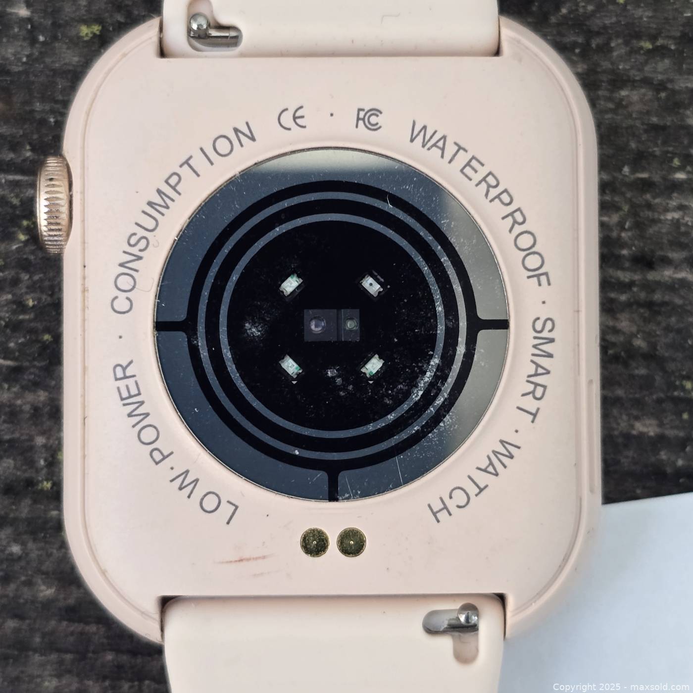 Casio Illuminator watch, pink JYouPro smartwatch, black Fitbit with ...