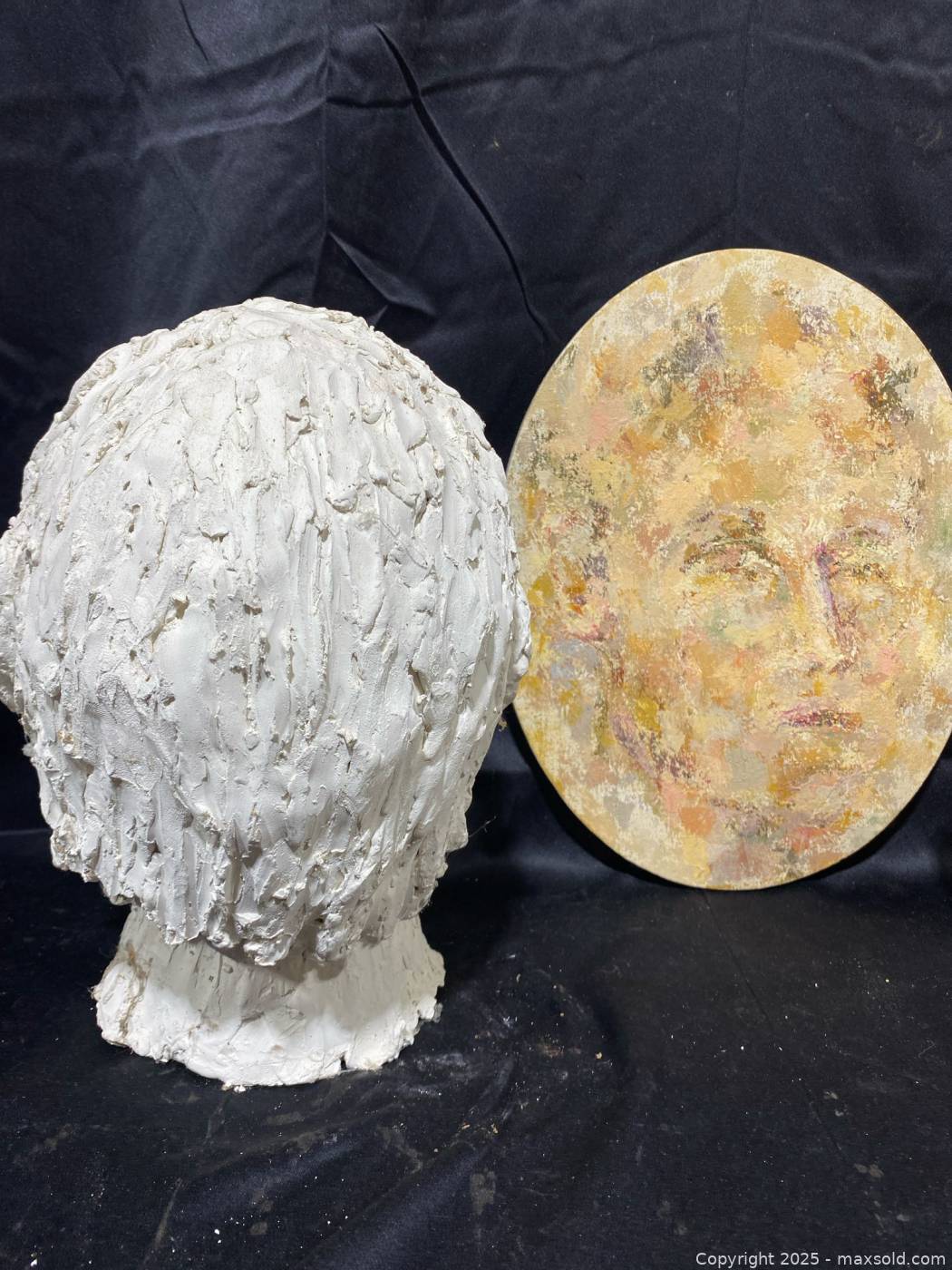 Handmade clay head sculptures with oval face painting | Maxsold