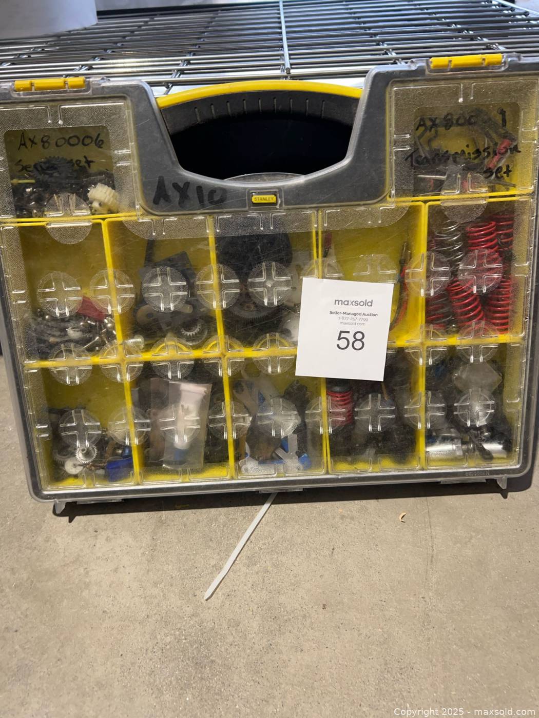 RC car shocks, springs, gears, hardware with Stanley organizer | Maxsold