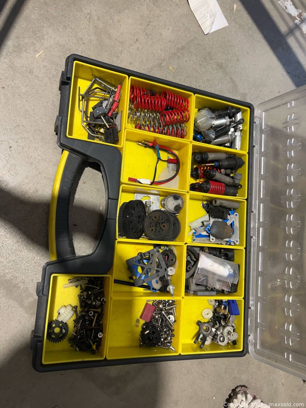 RC car shocks, springs, gears, hardware with Stanley organizer | Maxsold