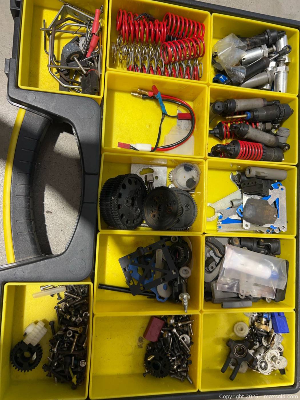 RC car shocks, springs, gears, hardware with Stanley organizer | Maxsold