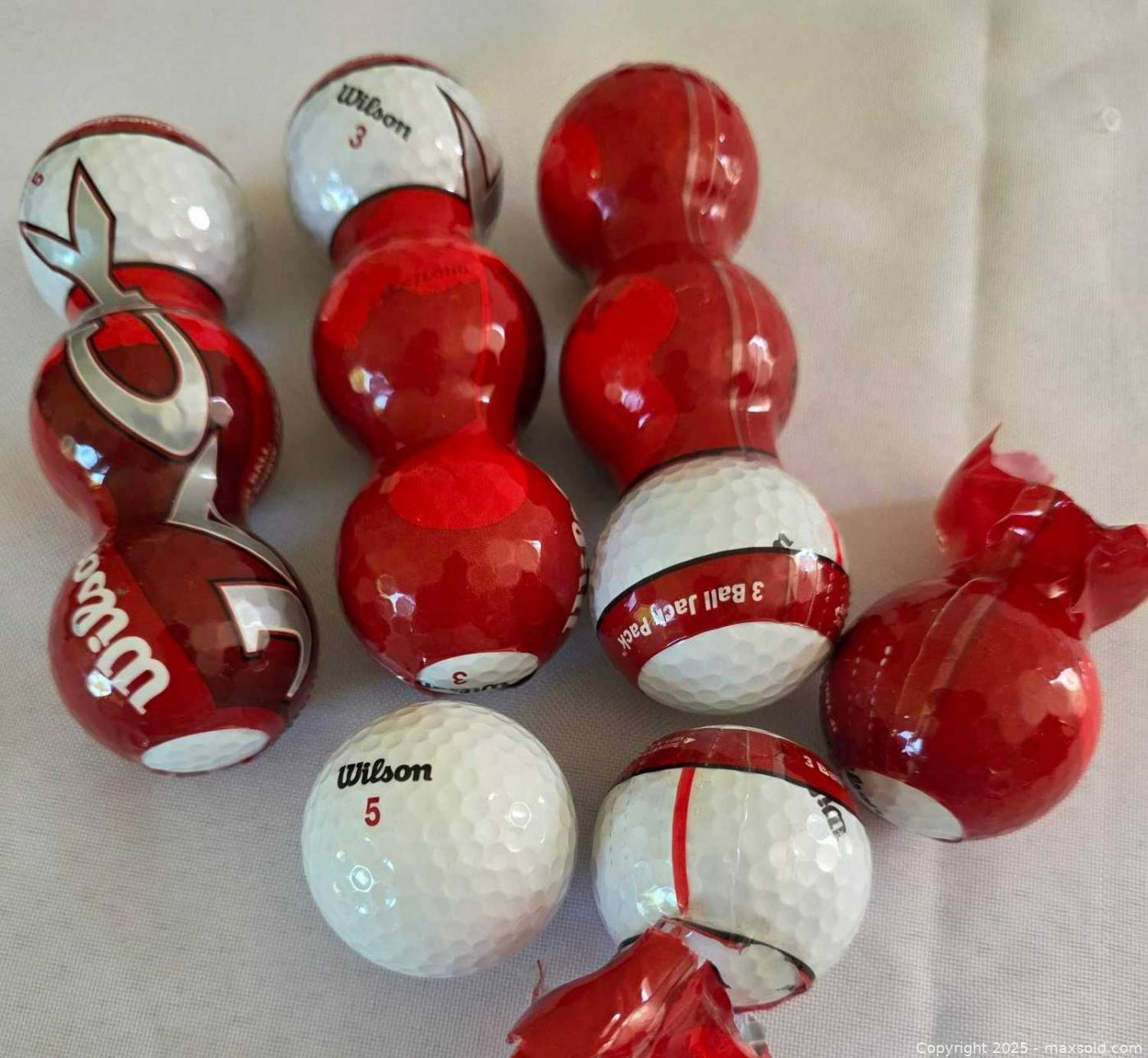 Golf balls, books, medallion, accessories | Maxsold