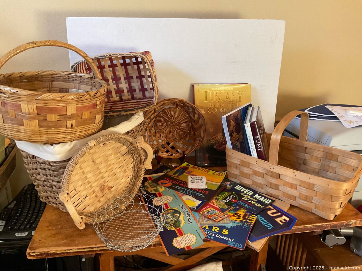 Baskets, books, vintage crate labels | Maxsold