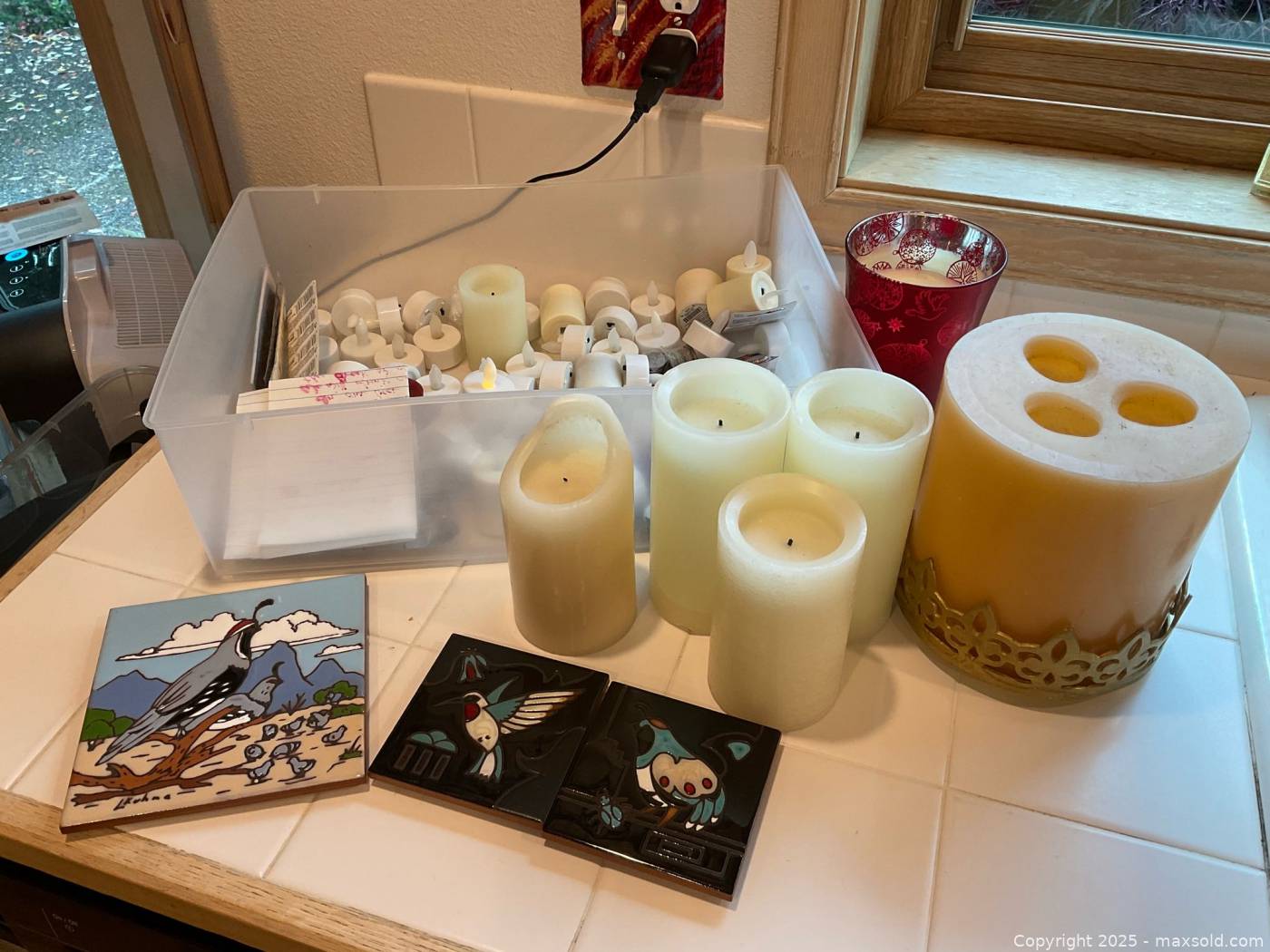 Battery-operated and regular candles with ceramic trivets | Maxsold