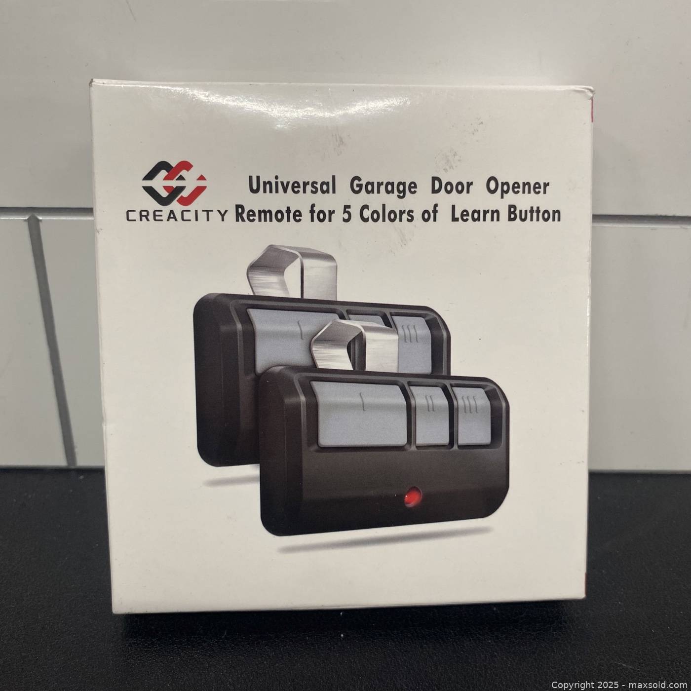 CreaCity universal garage door opener remotes, pair | Maxsold