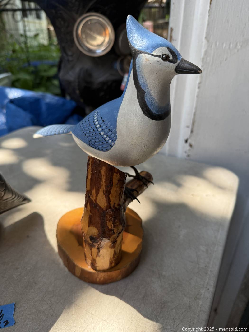 Hand-carved wood puffin and blue jay | Maxsold