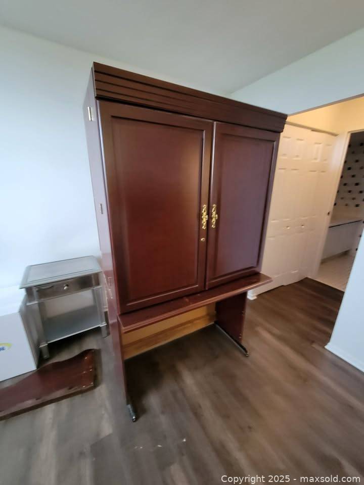 Upright desk armoire with shelving | Maxsold