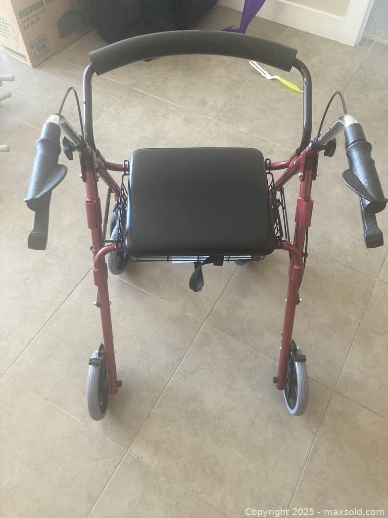 Rollator walker with seat and basket | Maxsold