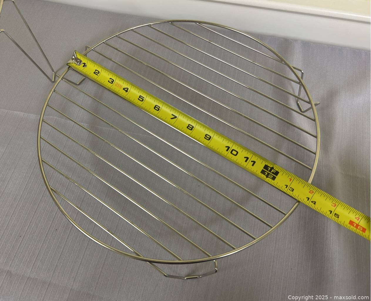 Two round stainless steel wire racks | Maxsold
