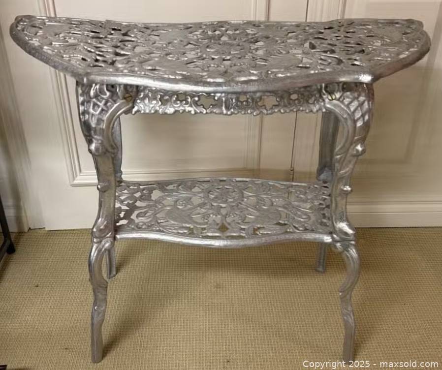 Silver two-tier demilune metal table | Maxsold