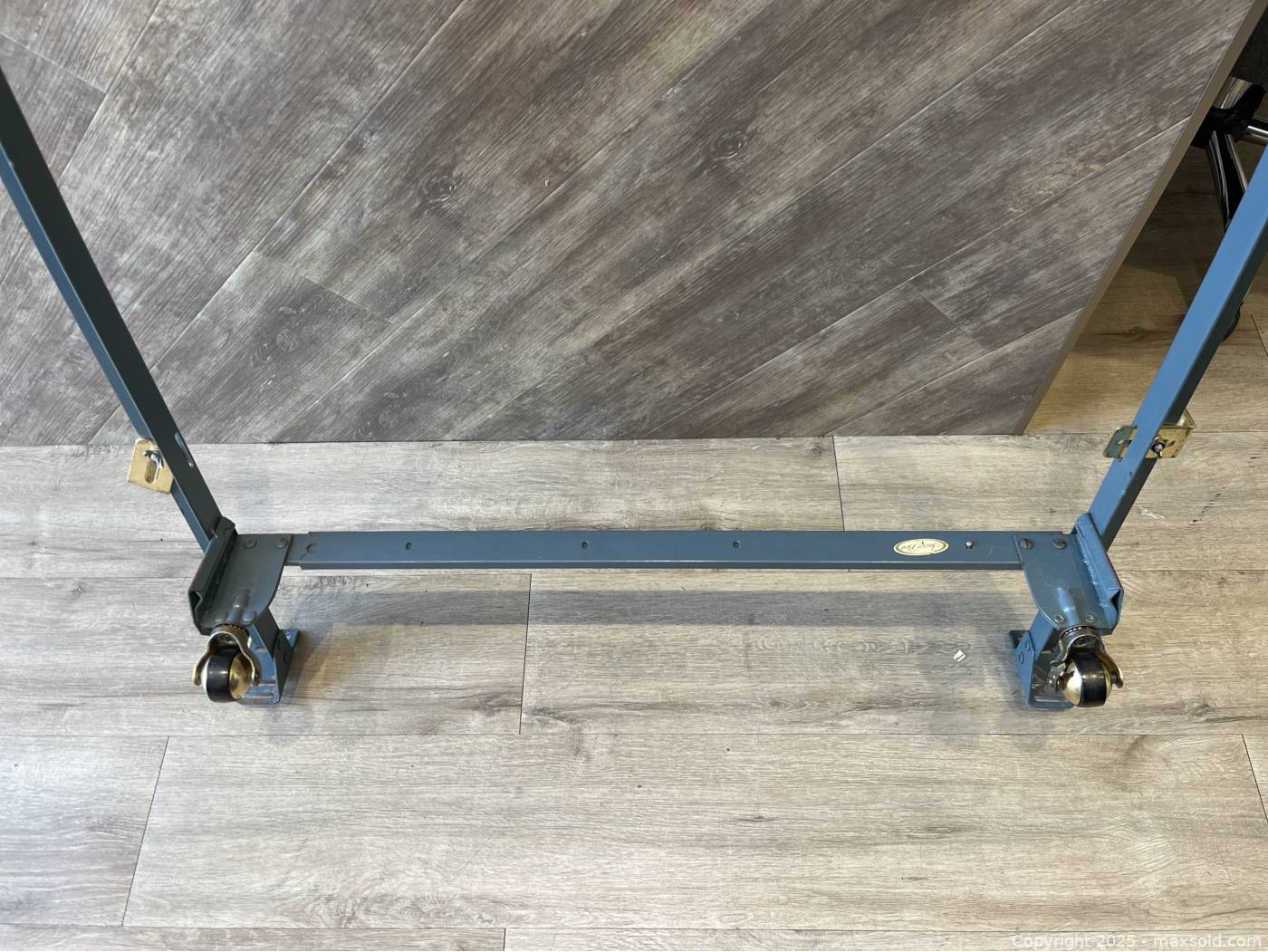 Adjustable metal bed frame on casters | Maxsold