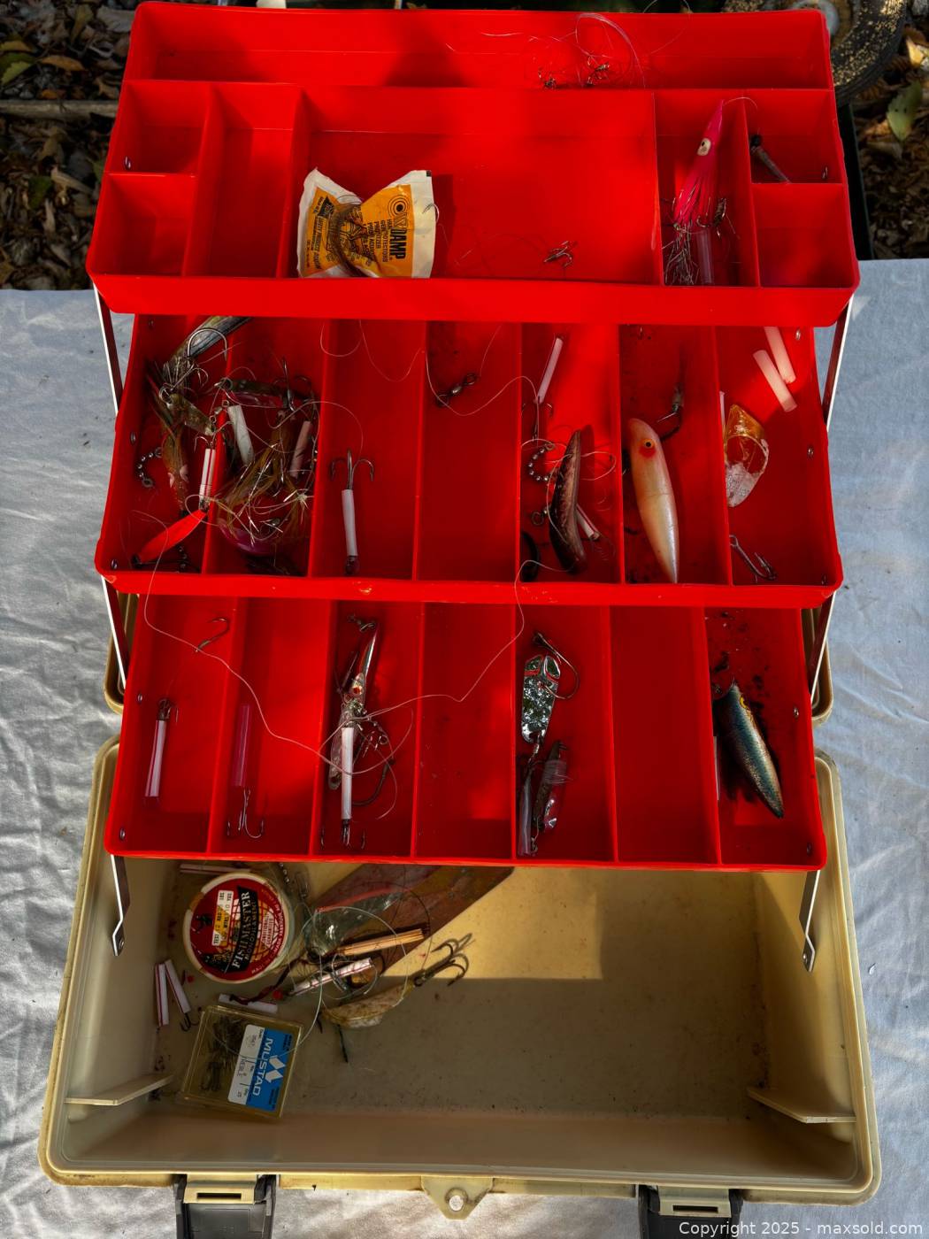 Flambeau tackle box with assorted fishing lures and tackle | Maxsold