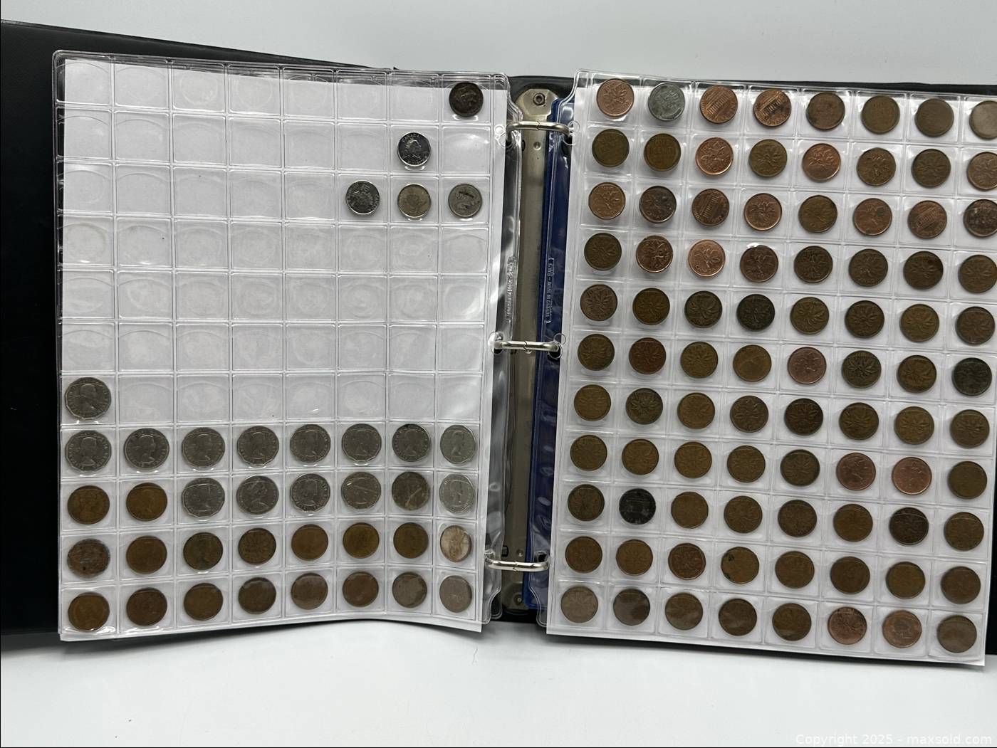 Binder with assorted coin collection | Maxsold