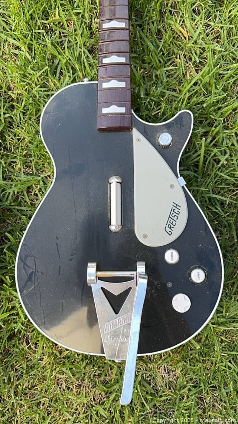 Five Guitar Hero and Rock Band guitar controllers | Maxsold