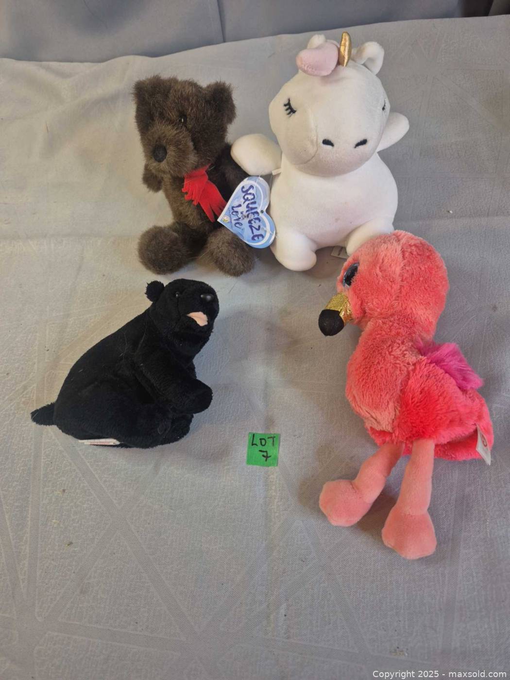 Four assorted plush toys | Maxsold