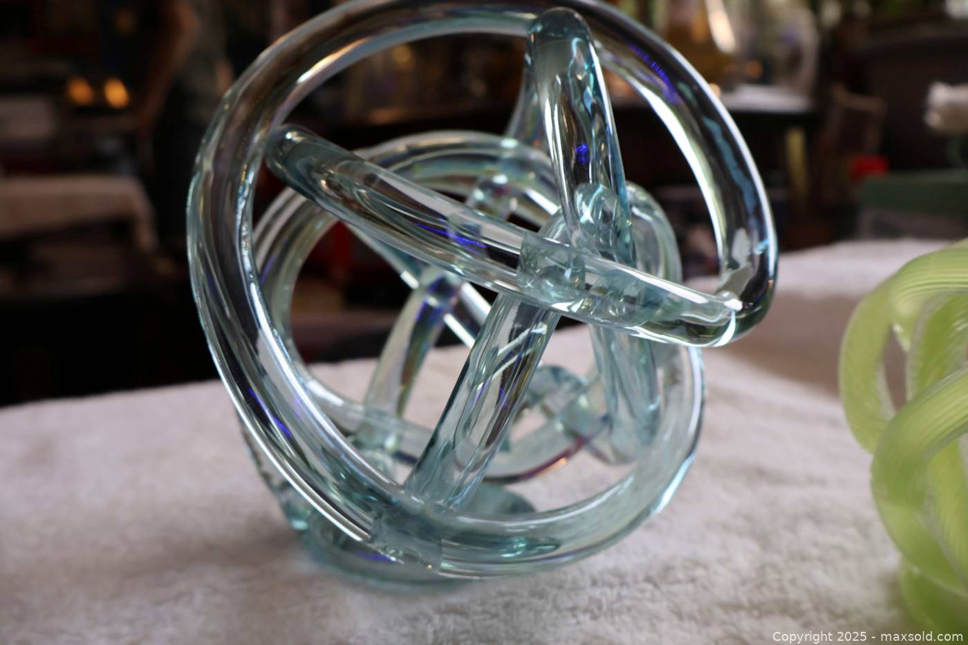 Two Twisted Art Glass Orbs | Maxsold