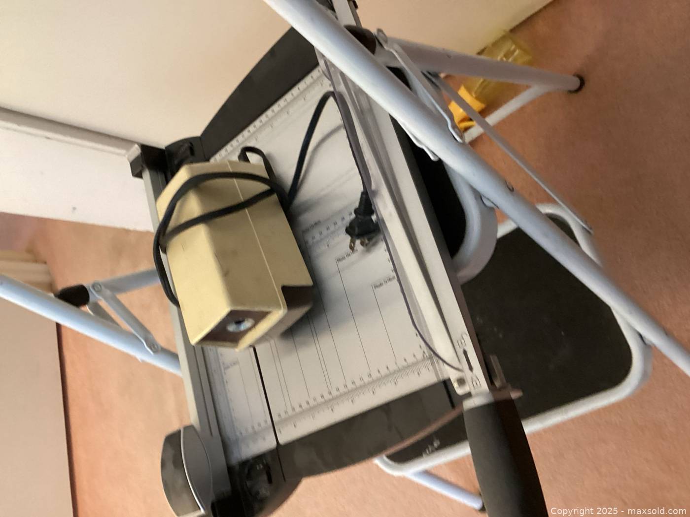 Collapsible paper cutter with stand and electric pencil sharpener | Maxsold