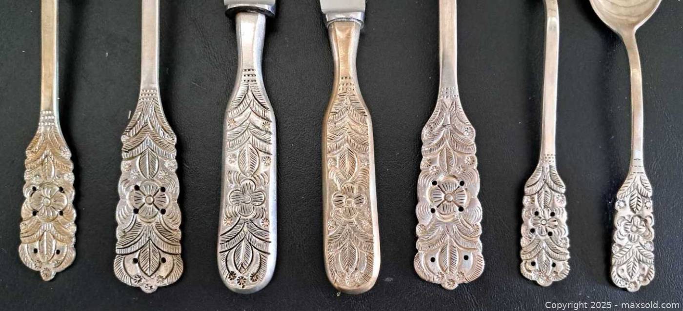 70-piece ornate flatware set, marked 900 | Maxsold