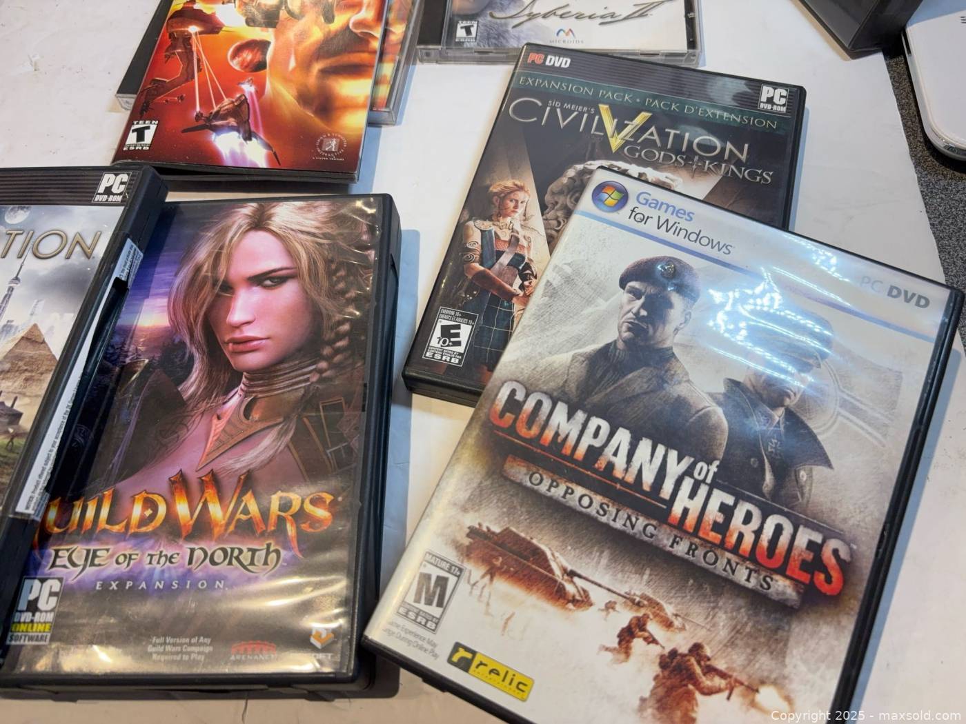 Dozen Windows PC game DVDs with codes | Maxsold