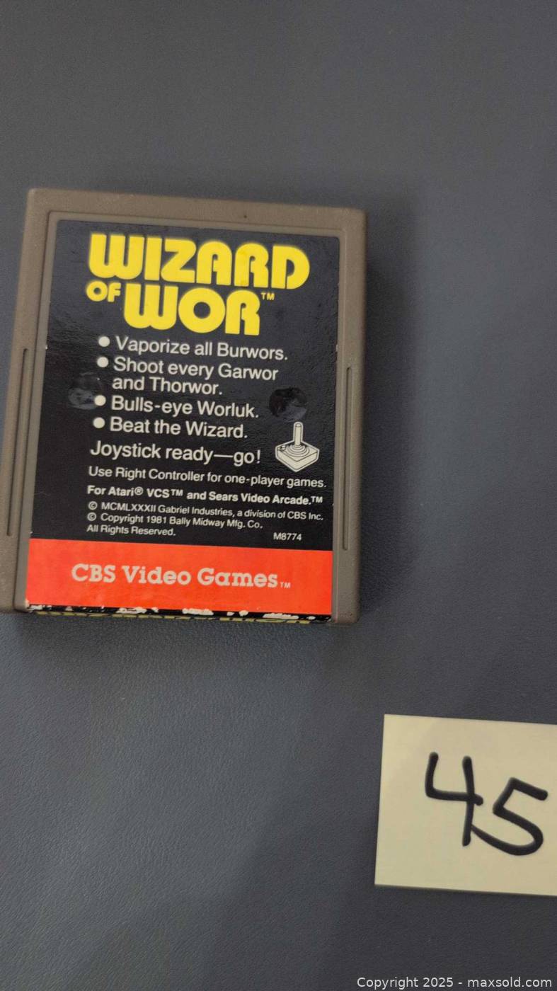 Atari 2600 Wizard of Wor cartridge and manual | Maxsold
