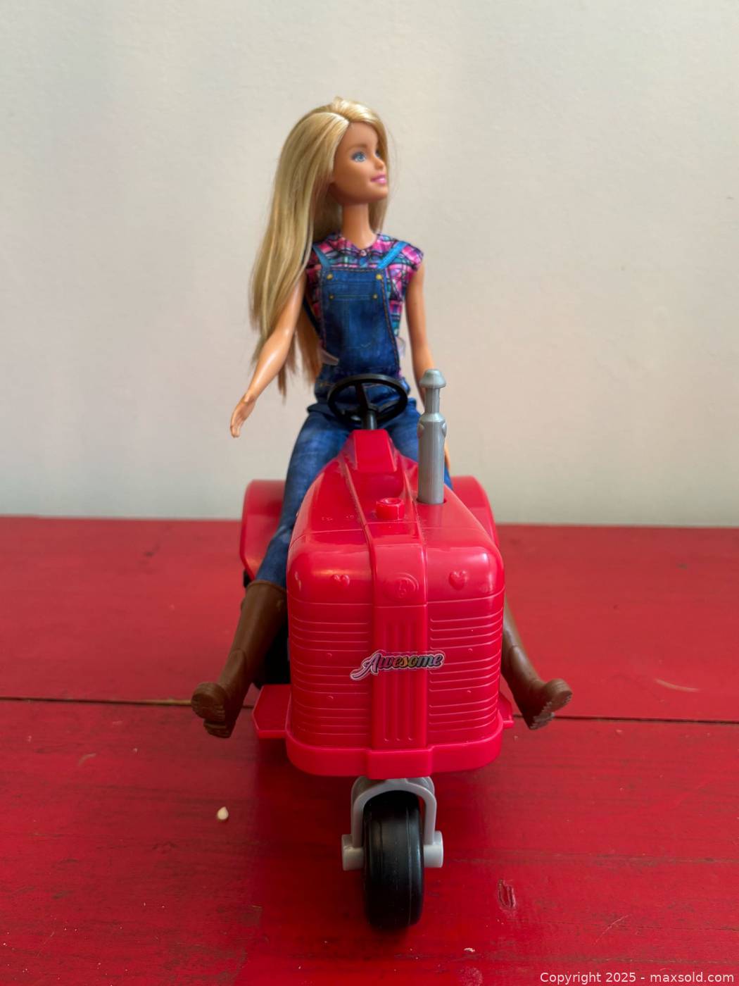 Barbie farmer doll with red tractor vehicle | Maxsold