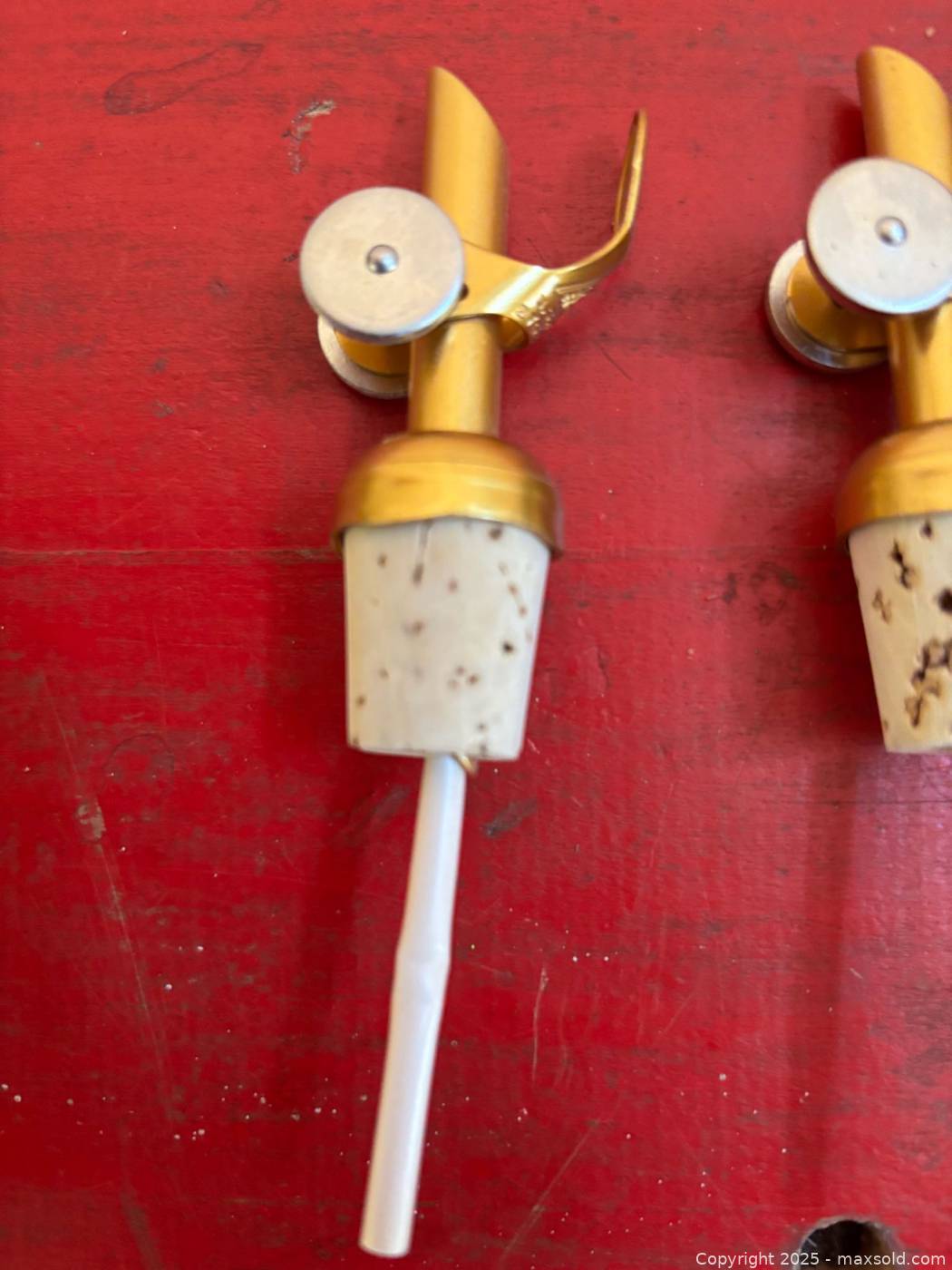 New art glass bottle stopper and two gold-tone cork pour spouts | Maxsold