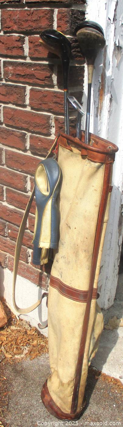 Vintage Spalding canvas golf bag with clubs | Maxsold
